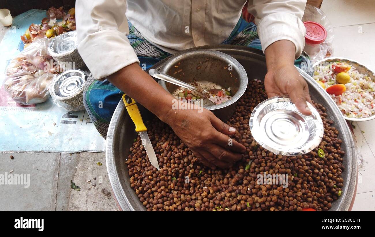 Street vendor roadside serving different fruits and vegetables in India ...