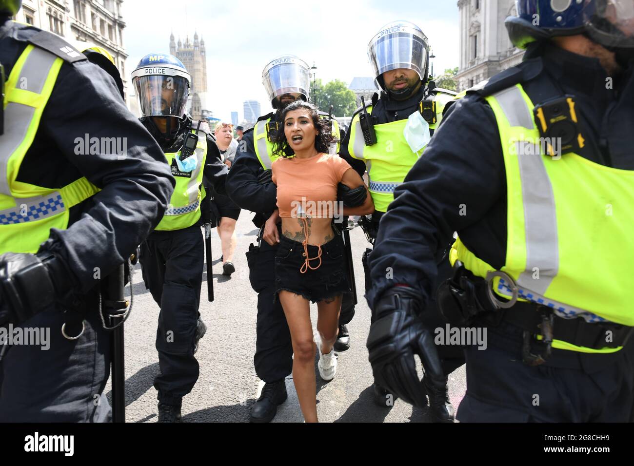 Woman led away by police hi-res stock photography and images - Alamy