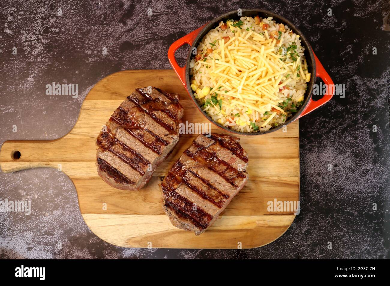 Delicious juicy Ancho steak with grill marks and accompaniment of ...