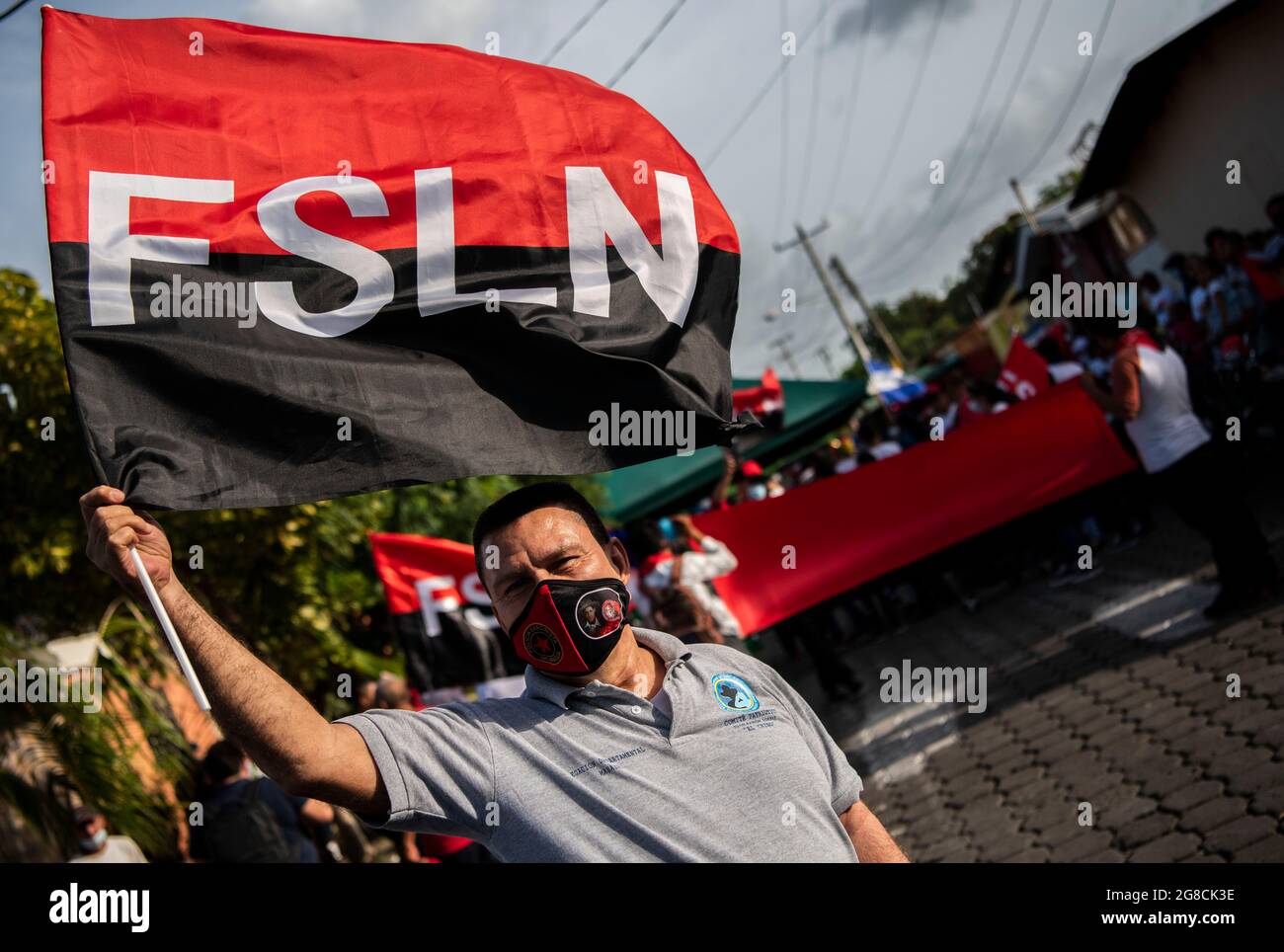 18 July 2021, Nicaragua, Managua: A man waves a Sandinista National ...