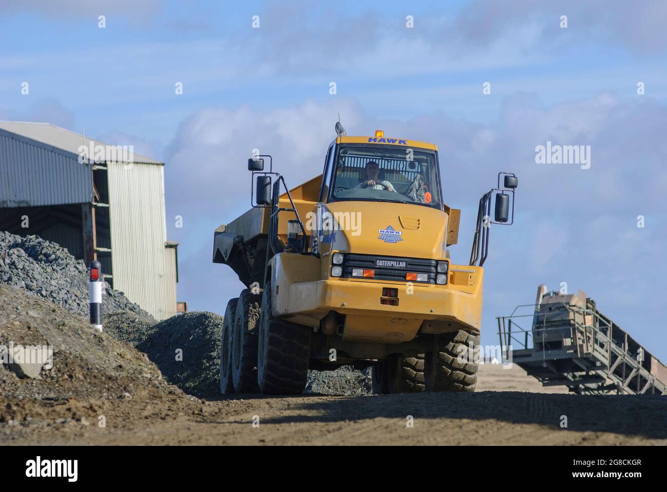 Caterpillar 725 articulated dump truck working in a quarry in England ...