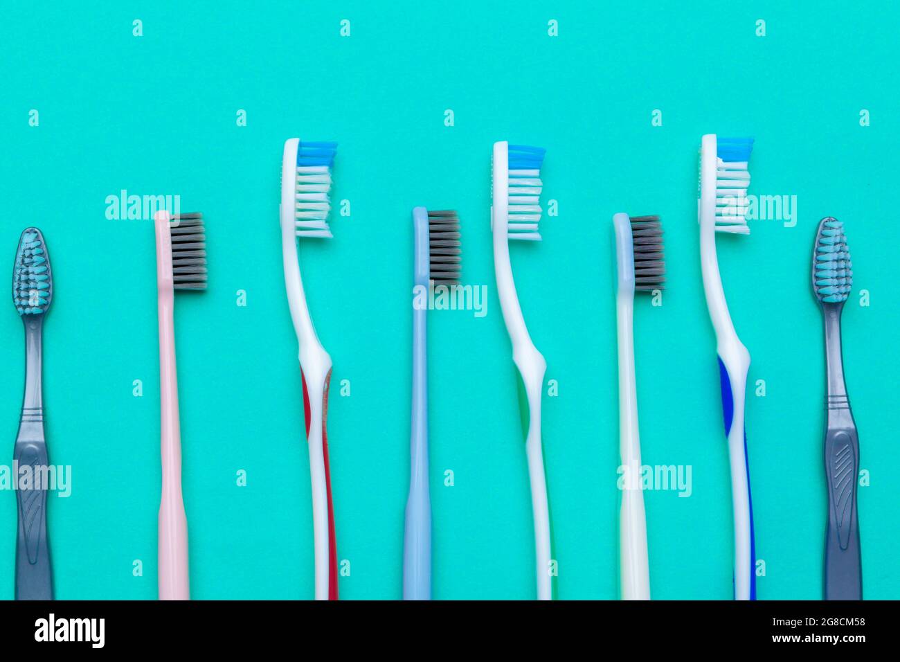 Flat lay composition with manual toothbrushes on color background ...