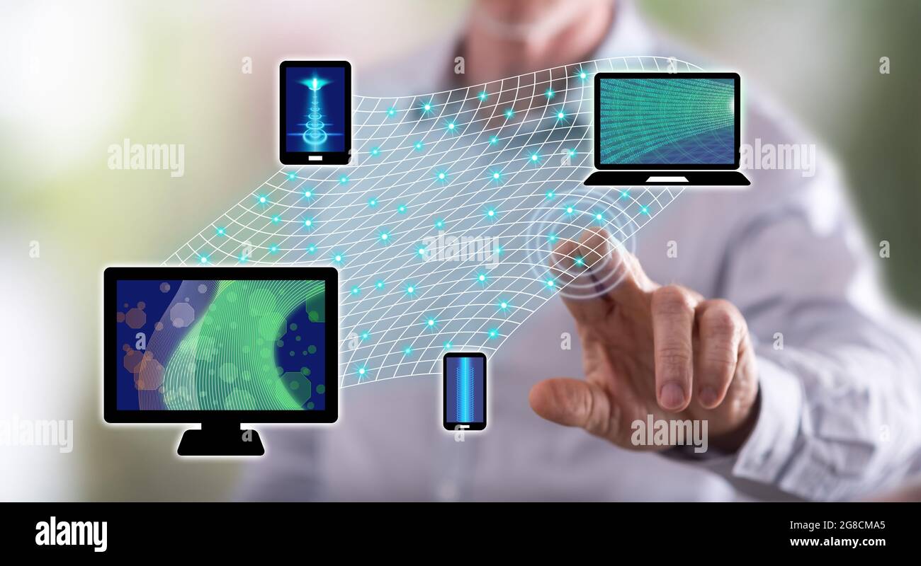 Man touching a device connection concept on a touch screen with his ...