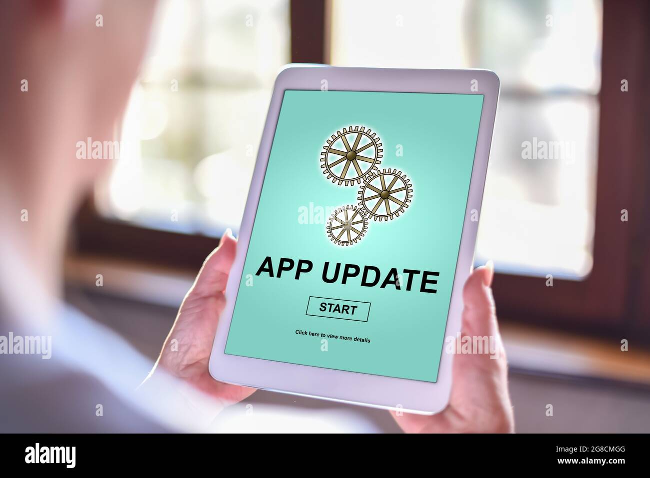 Tablet screen displaying an application update concept Stock Photo - Alamy