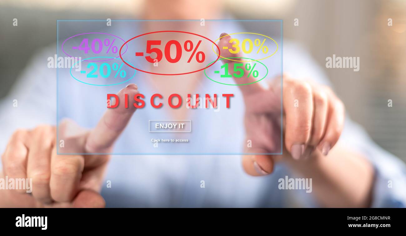 Woman touching a discount concept on a touch screen with her fingers ...