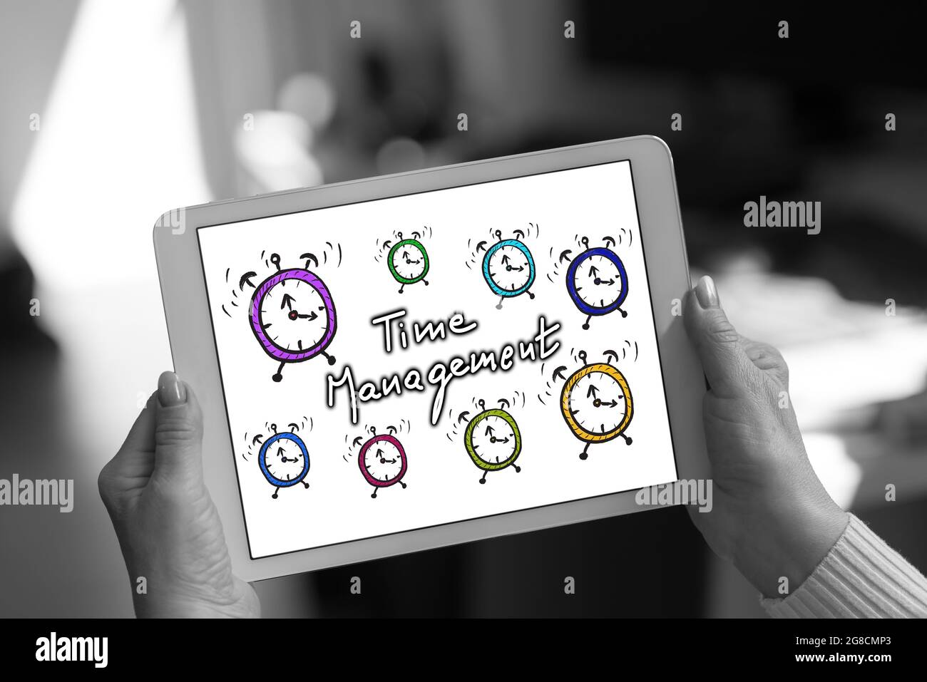 Time management concept shown on a tablet held by a woman Stock Photo ...