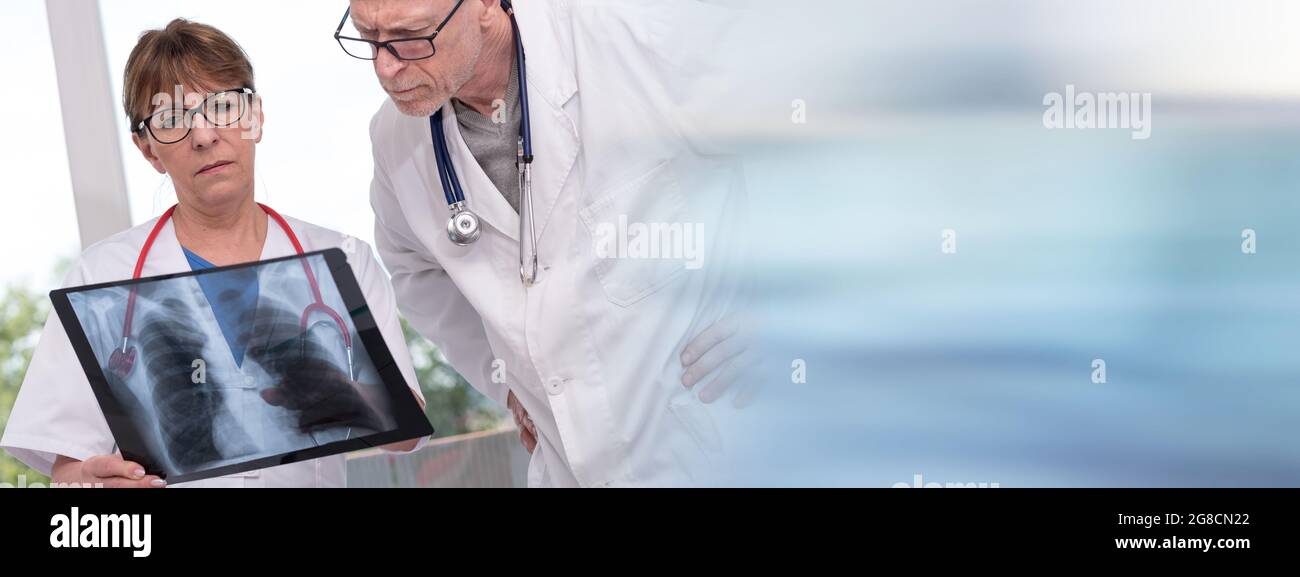 Doctors examining ray report in hi-res stock photography and images - Alamy
