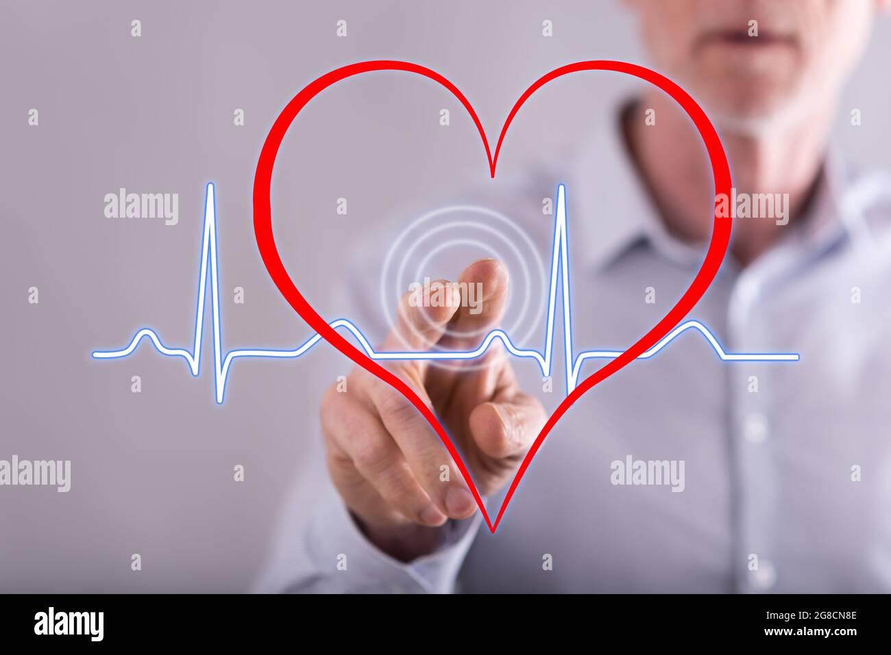 Man touching a heart beats graph on a touch screen with his finger ...