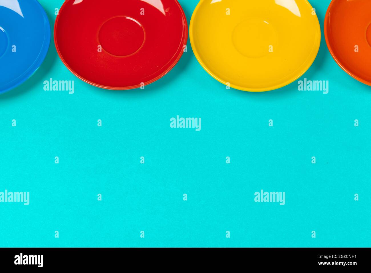 Colorful saucers on a vibrant bright background Stock Photo - Alamy