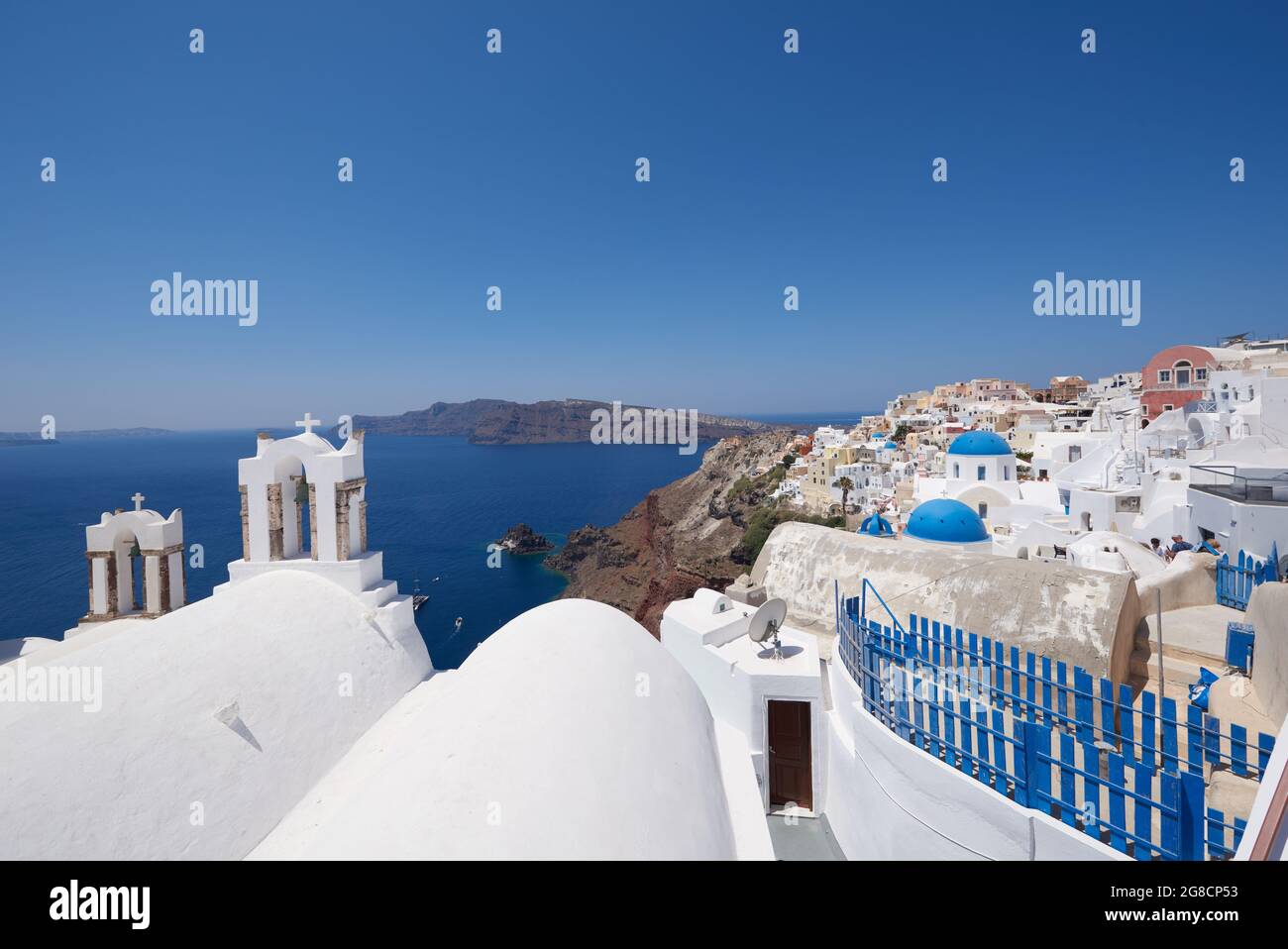 Traditional whitewashed church and residential buildings in Santorini ...