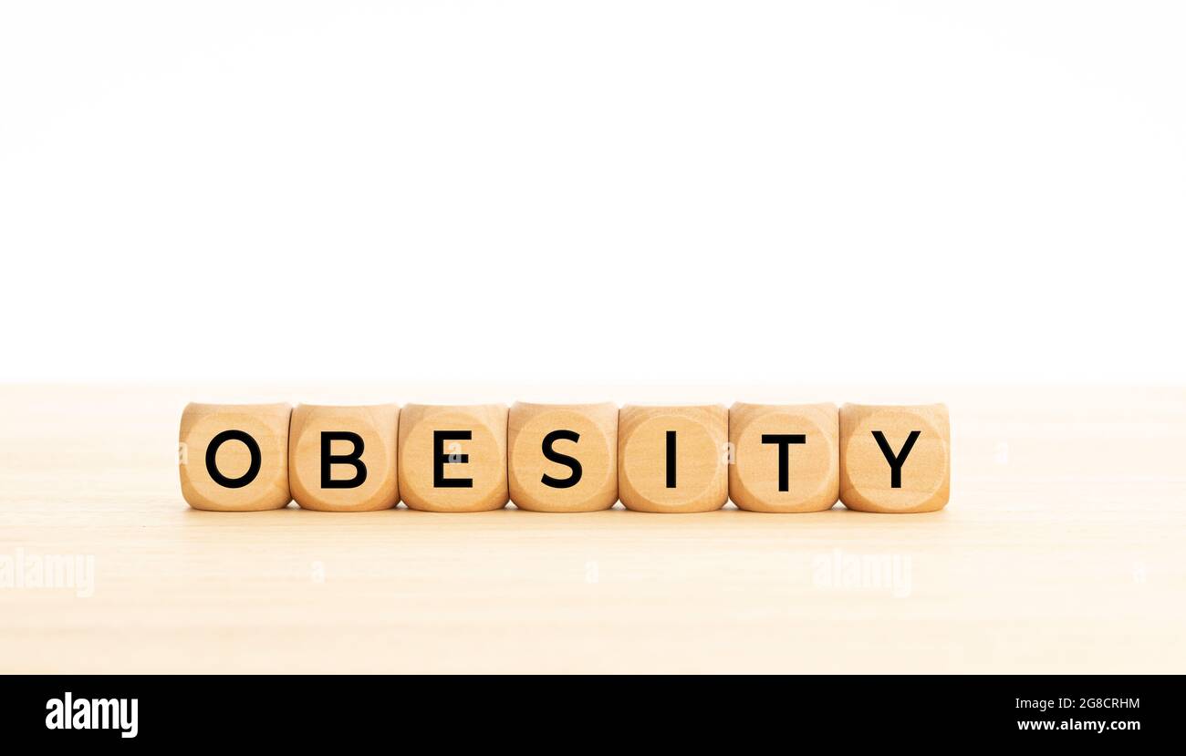 Obesity word on wooden block. Copy space. White background Stock Photo ...