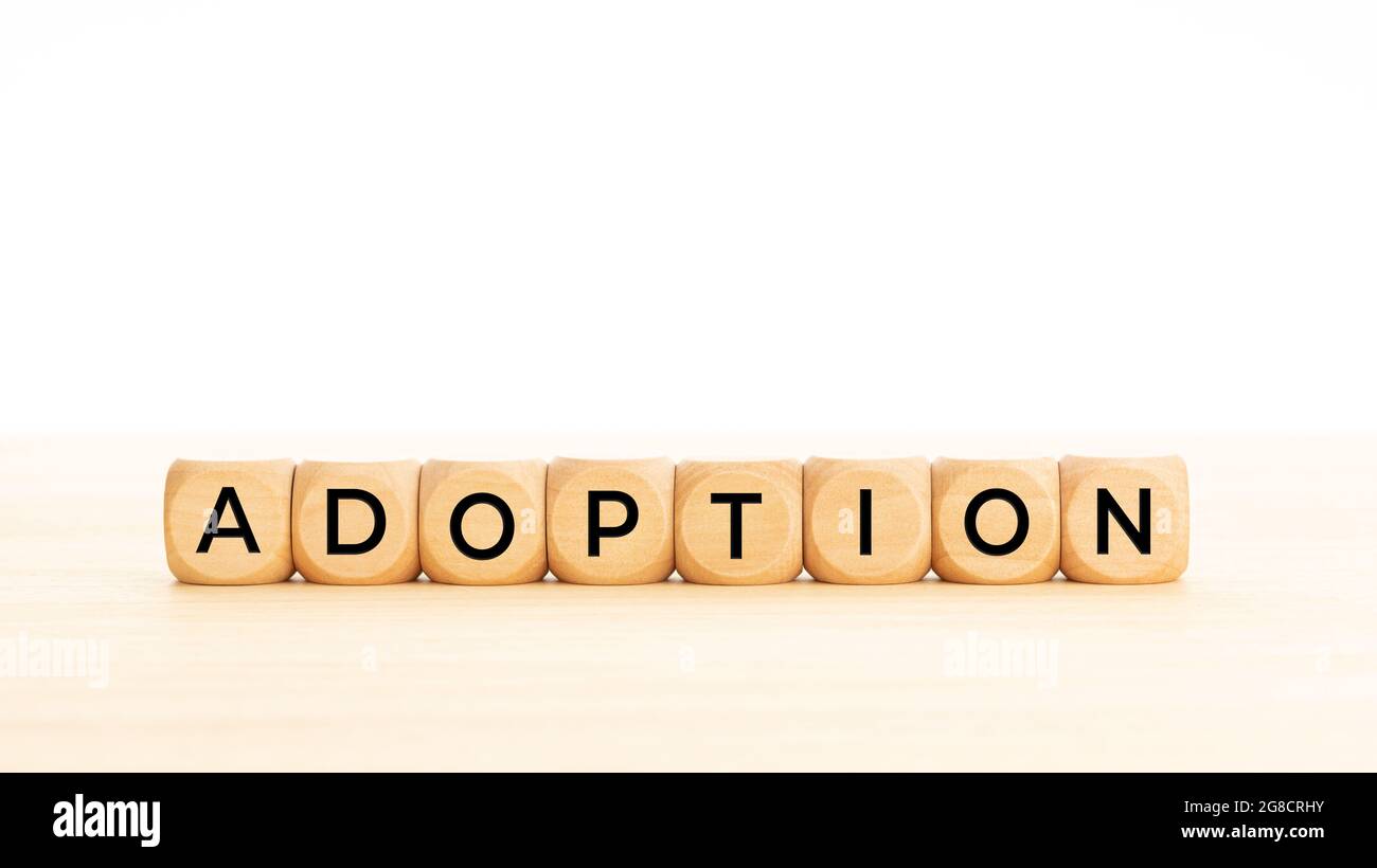 Adoption word on wooden blocks. Copy space. White background Stock ...