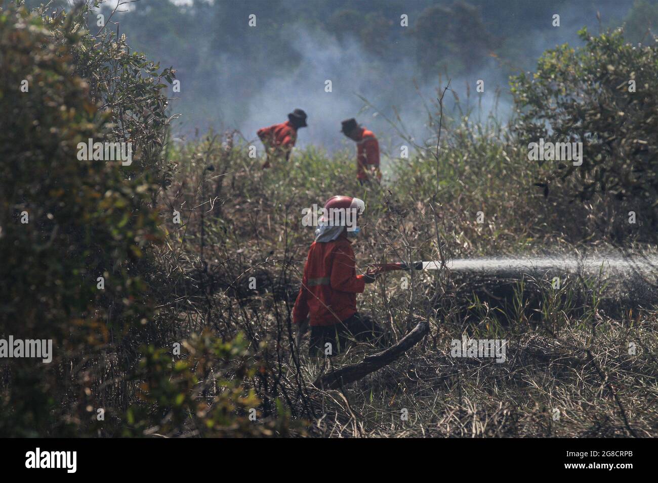 Indonesia fire fighter hi-res stock photography and images - Alamy