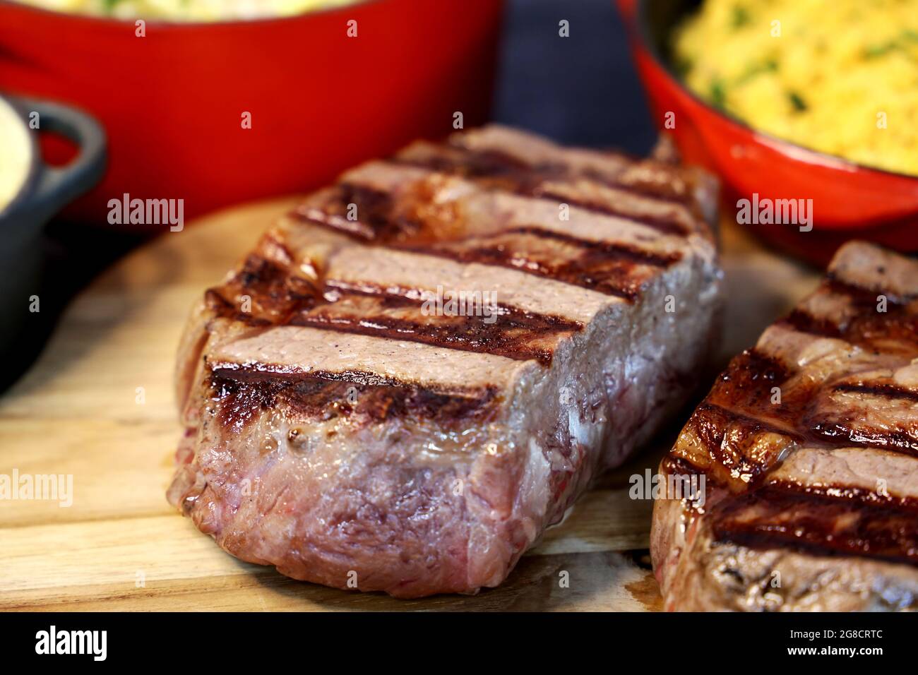 Delicious juicy Ancho steak with grill marks and accompaniment of ...