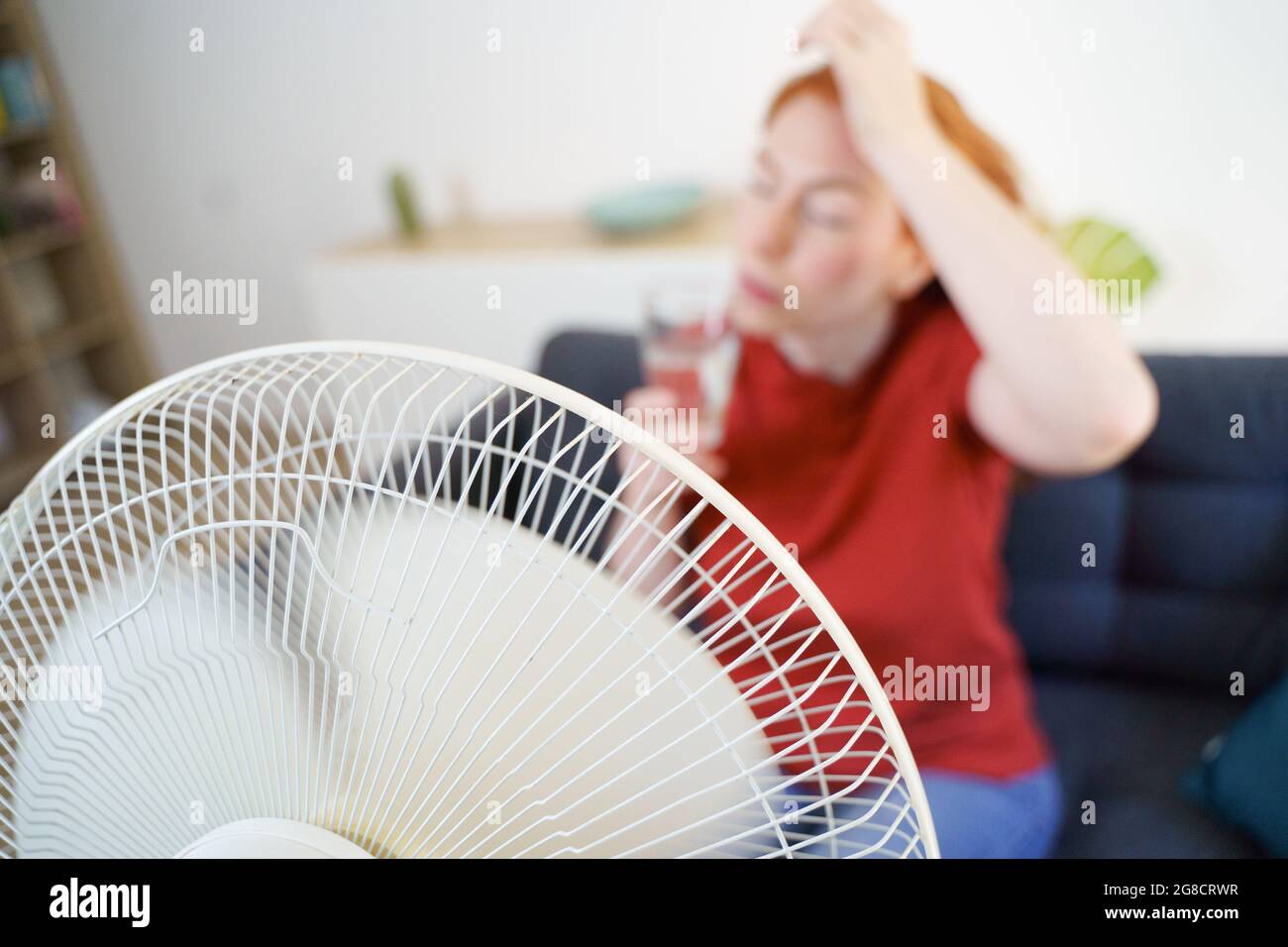 Woman sweating fan hi-res stock photography and images - Alamy