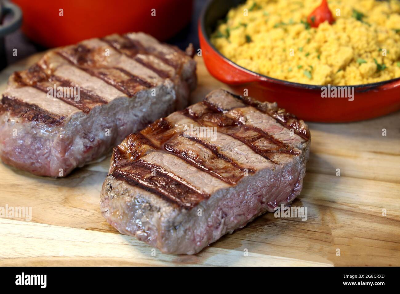 Delicious juicy Ancho steak with grill marks and accompaniment of ...