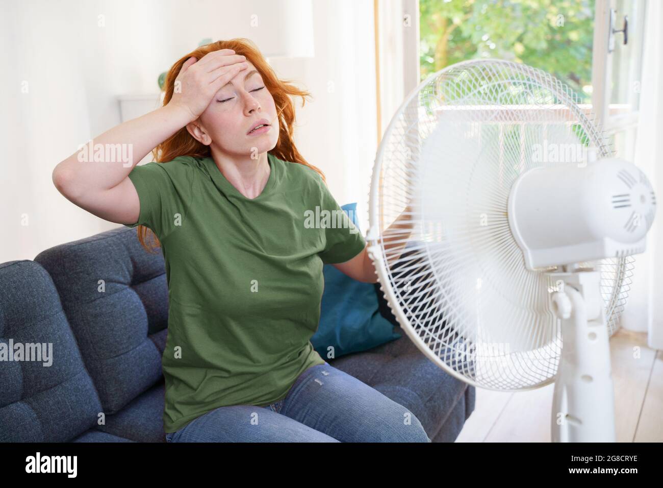 Too hot woman sweating fan hi-res stock photography and images - Alamy