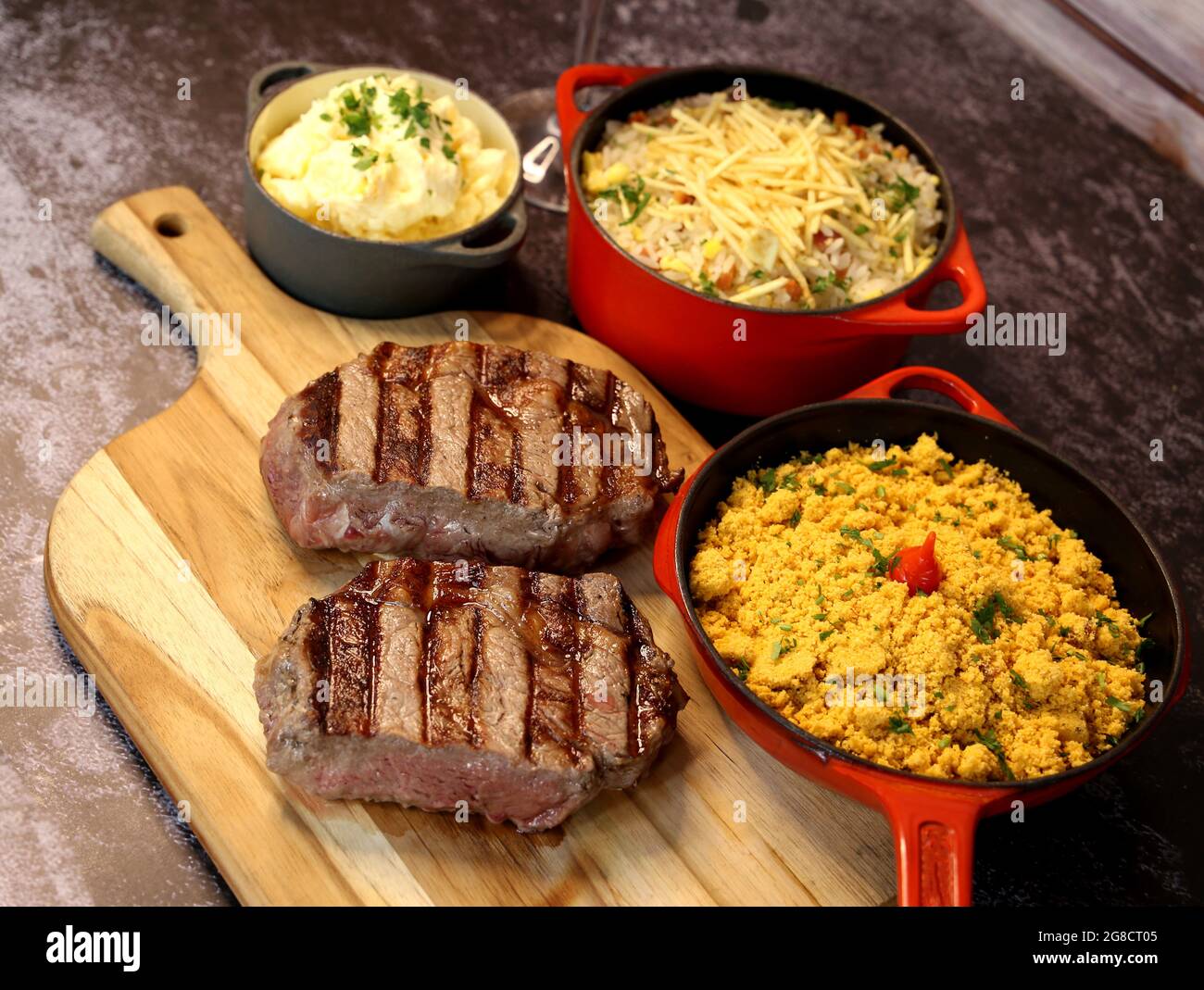 Delicious juicy Ancho steak with grill marks and accompaniment of ...