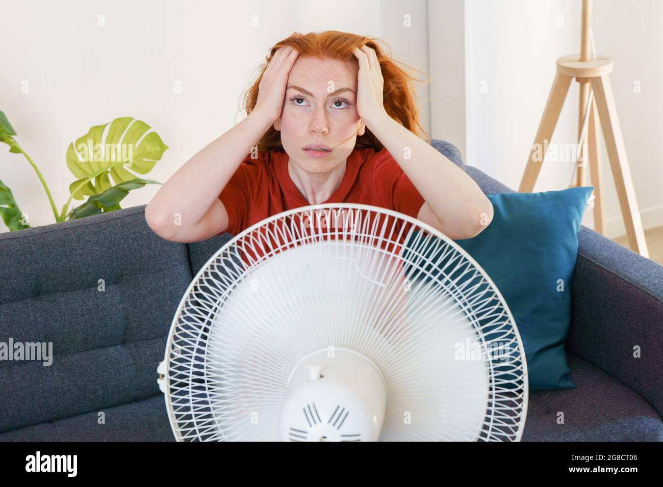 Too hot woman sweating fan hi-res stock photography and images - Alamy