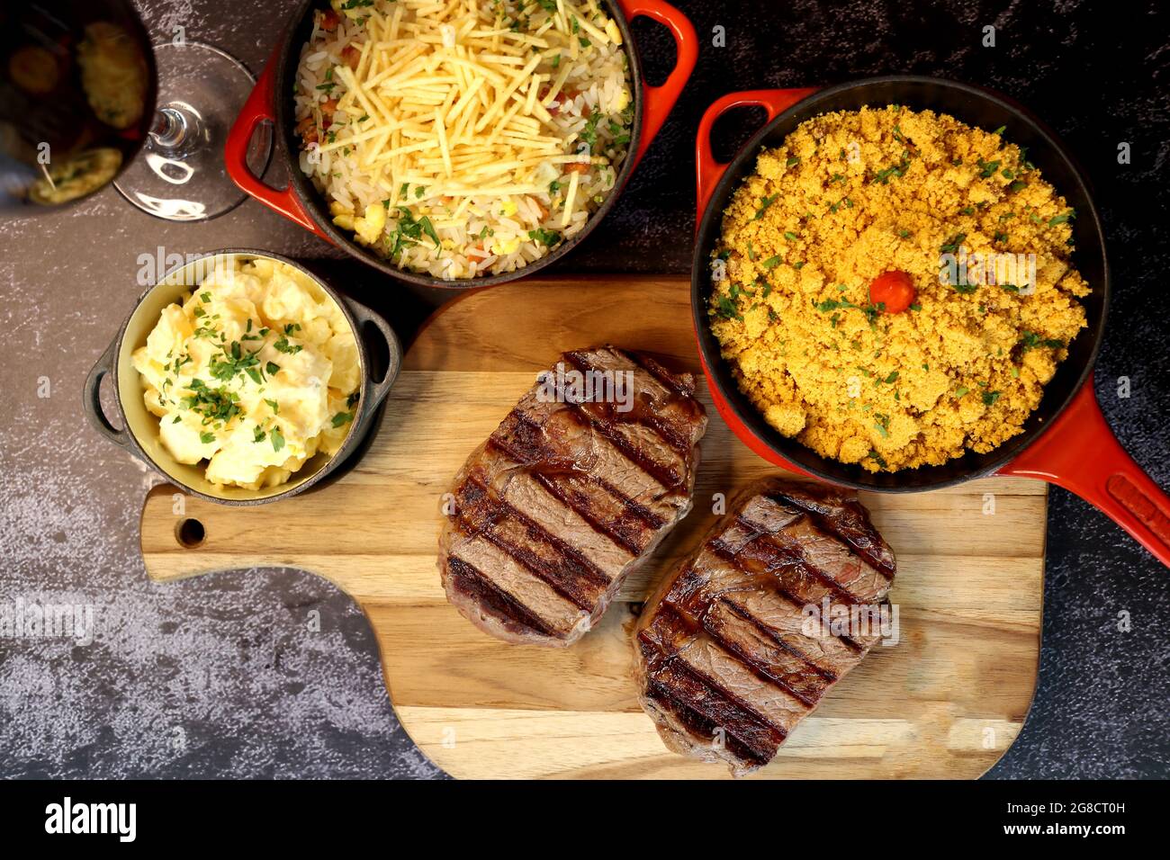 Delicious juicy Ancho steak with grill marks and accompaniment of ...