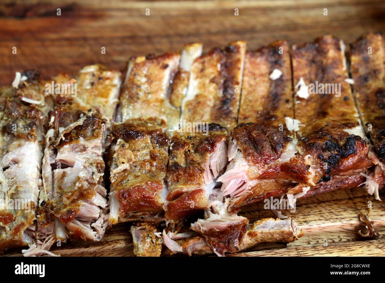 Ribs pork in brazilian barbecue. With wooden background. Close up Stock ...