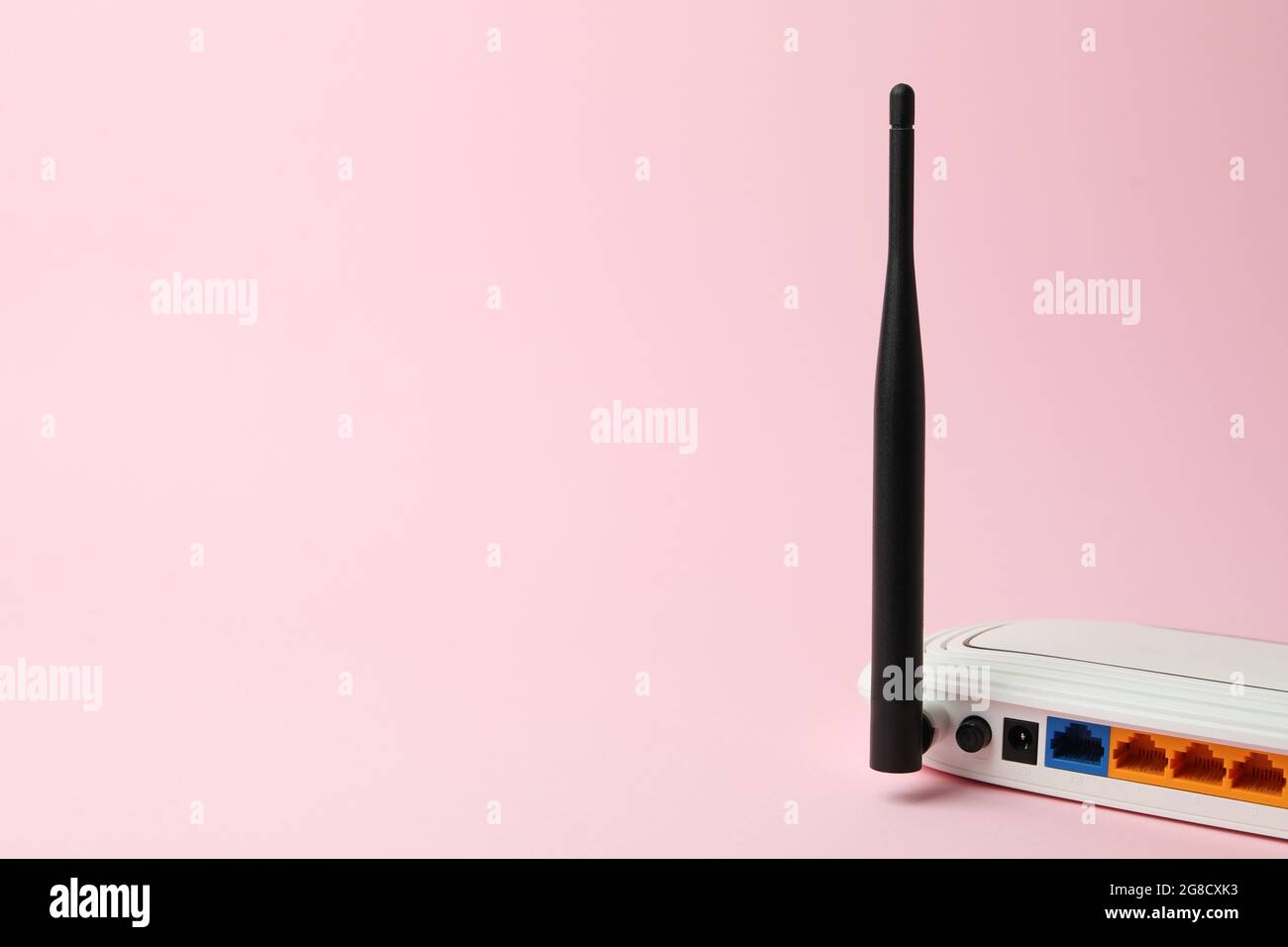 Wi-Fi router with external antennas on pink background Stock Photo - Alamy
