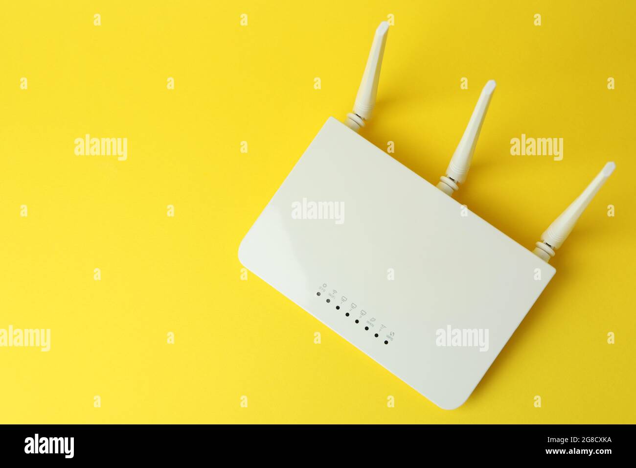 Wi-Fi router with external antennas on yellow background Stock Photo ...