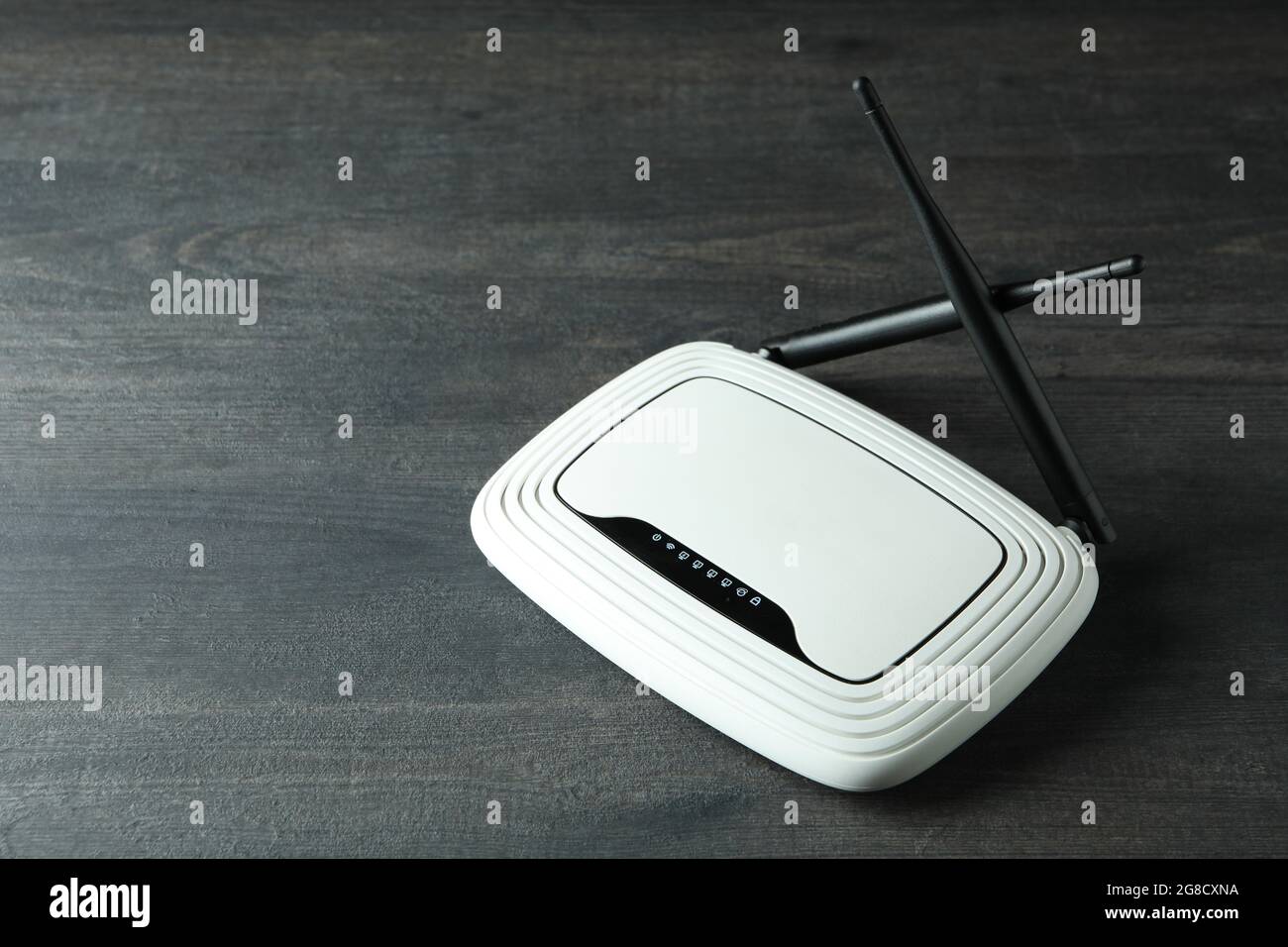 Wi-Fi router with external antennas on dark wooden background Stock ...