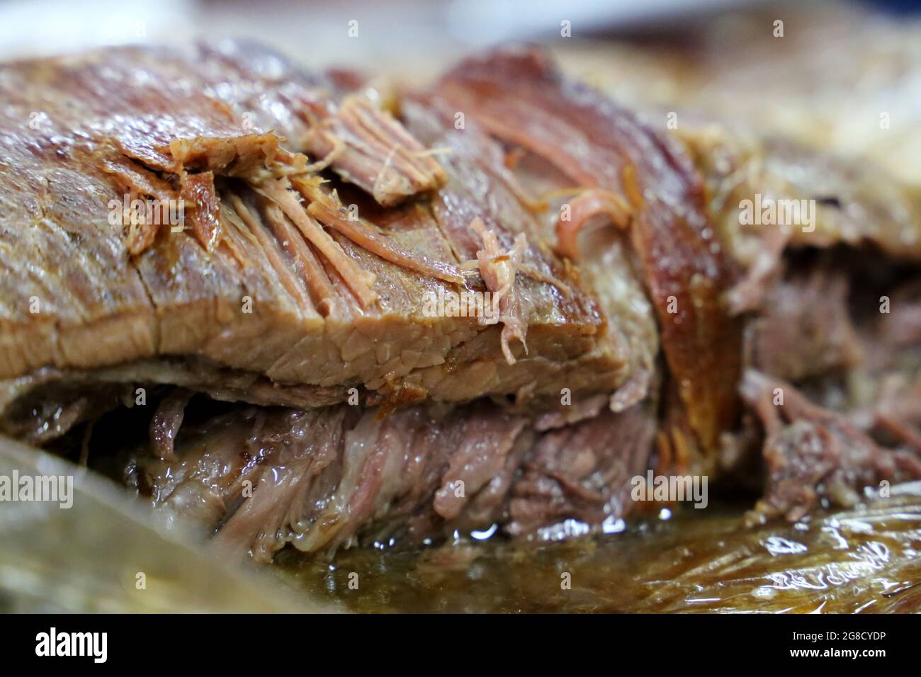 Costela. Delicious roast rib with big bones. Served on a wooden board Stock Photo - Alamy