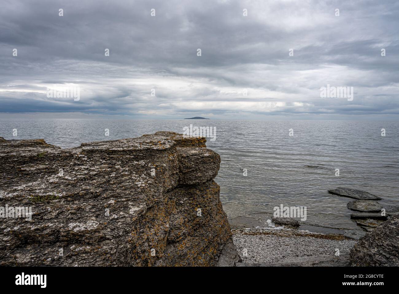 A beautiful limestone formation with a dramatic sky in the background ...