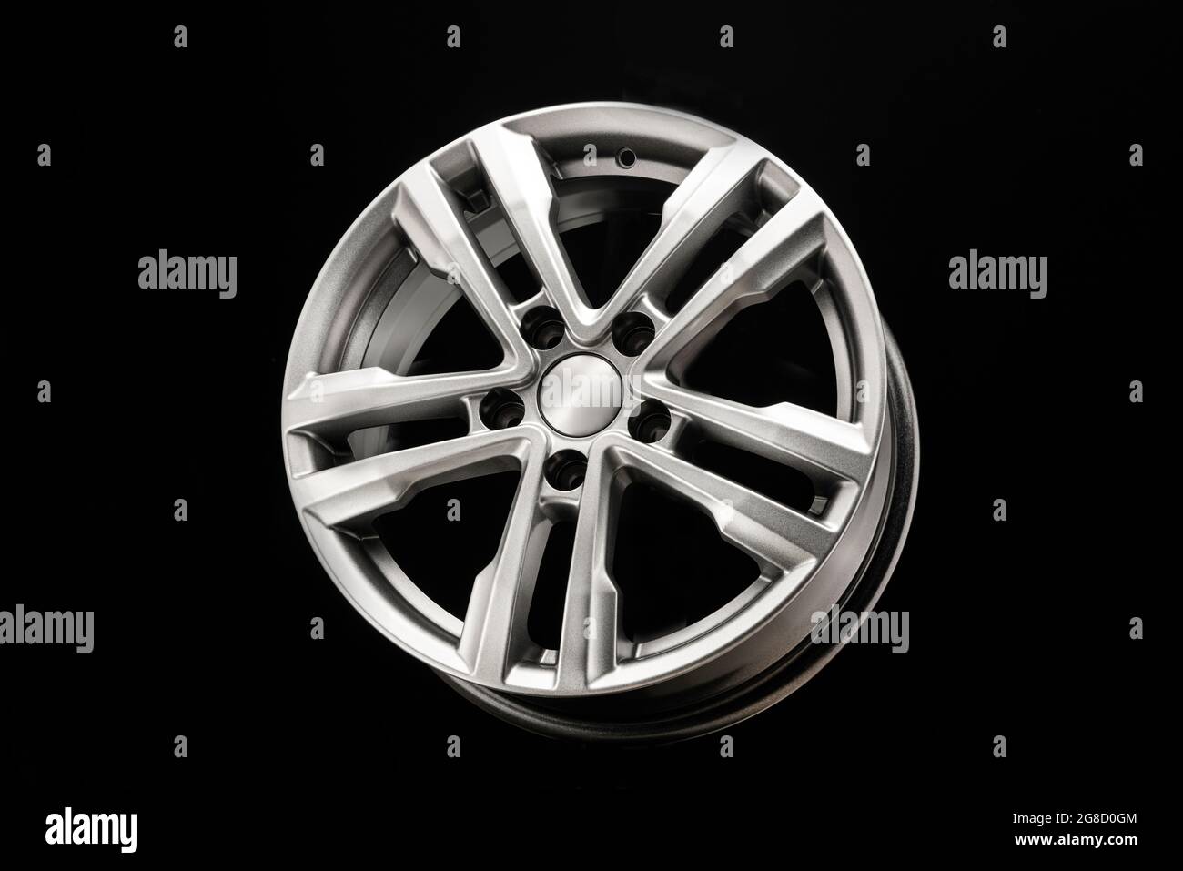 grey silver alloy wheel on black background Stock Photo - Alamy