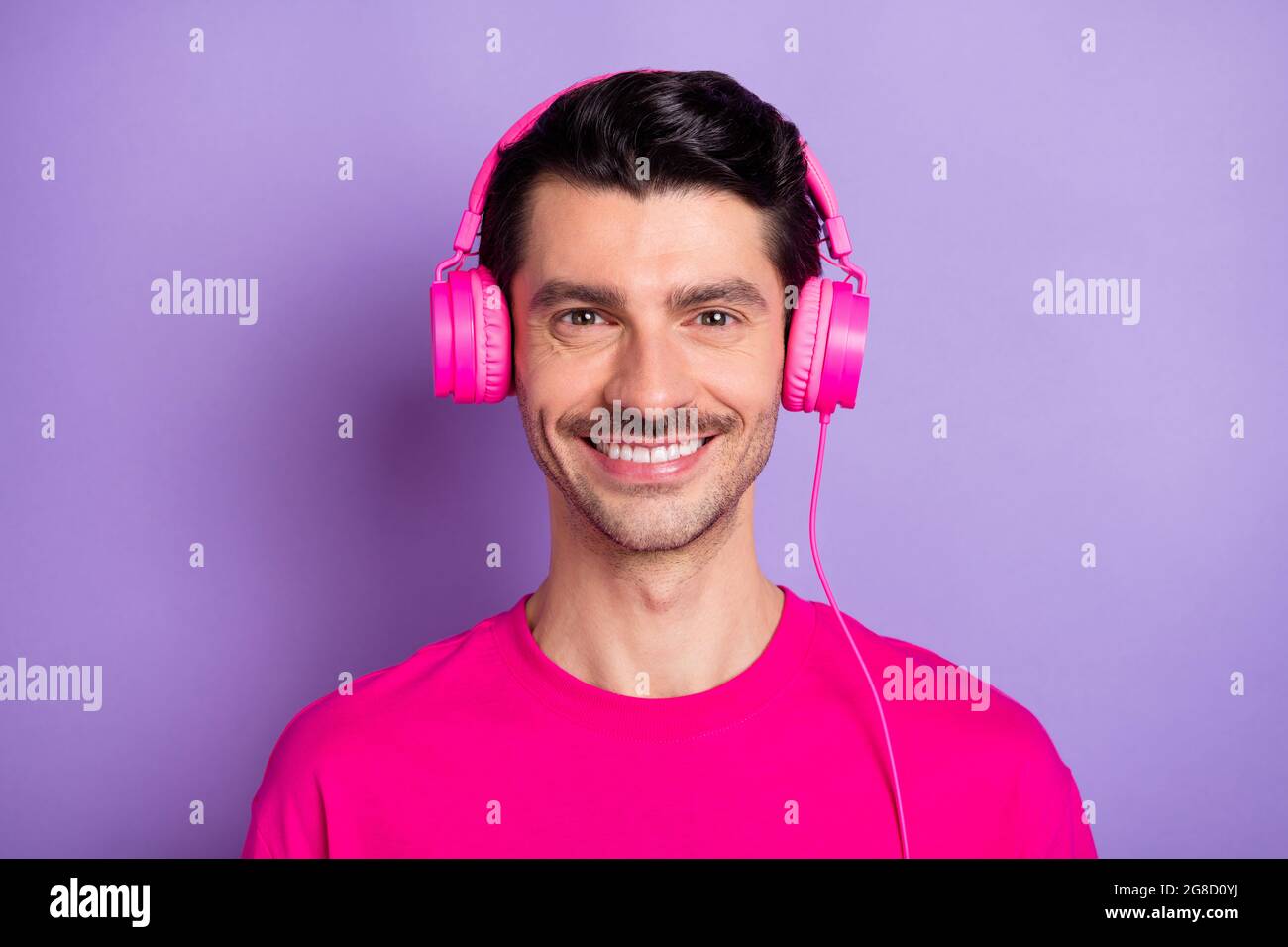 Photo of young happy cheerful good mood smiling man listening enjoying ...