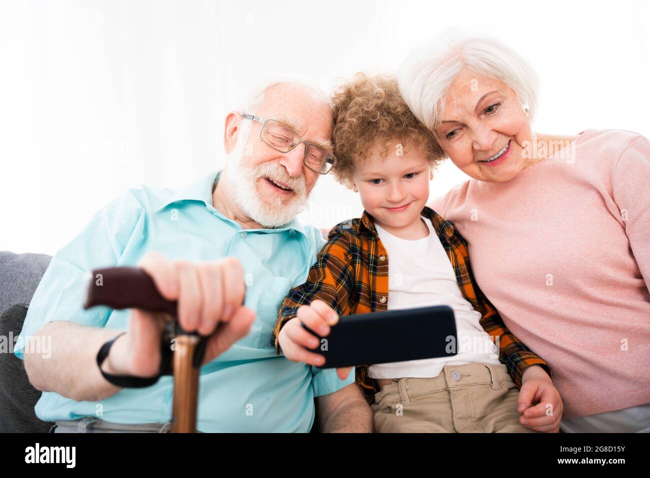 Grandparents and grandson playing at home - Family at home, grandmother ...