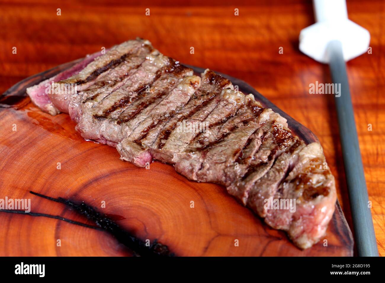 Closeup hand cutting steak knife hi-res stock photography and images ...