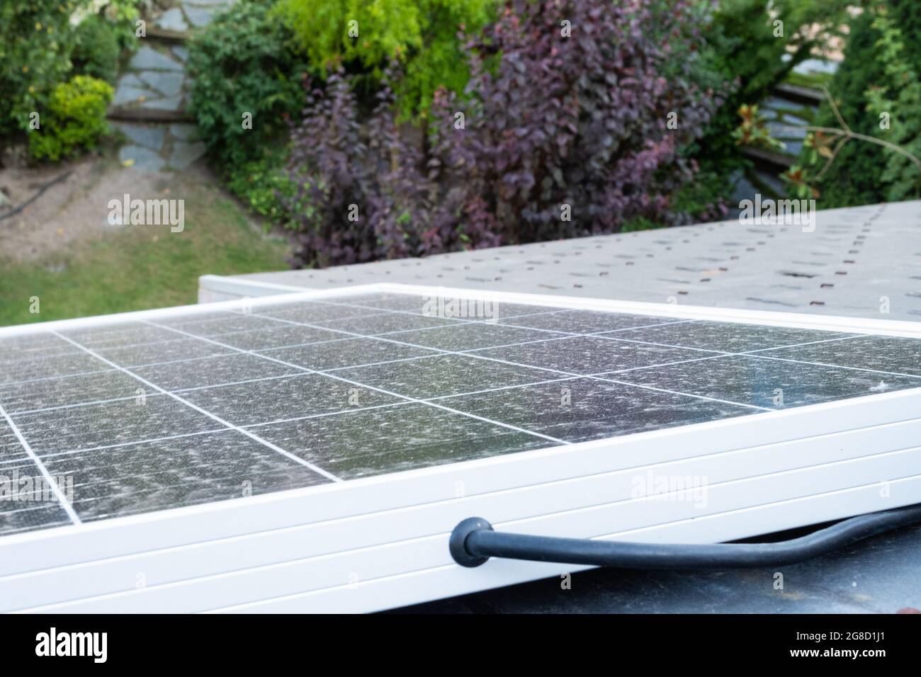 Solar panel renewable energy with a green garden underneath Stock Photo ...