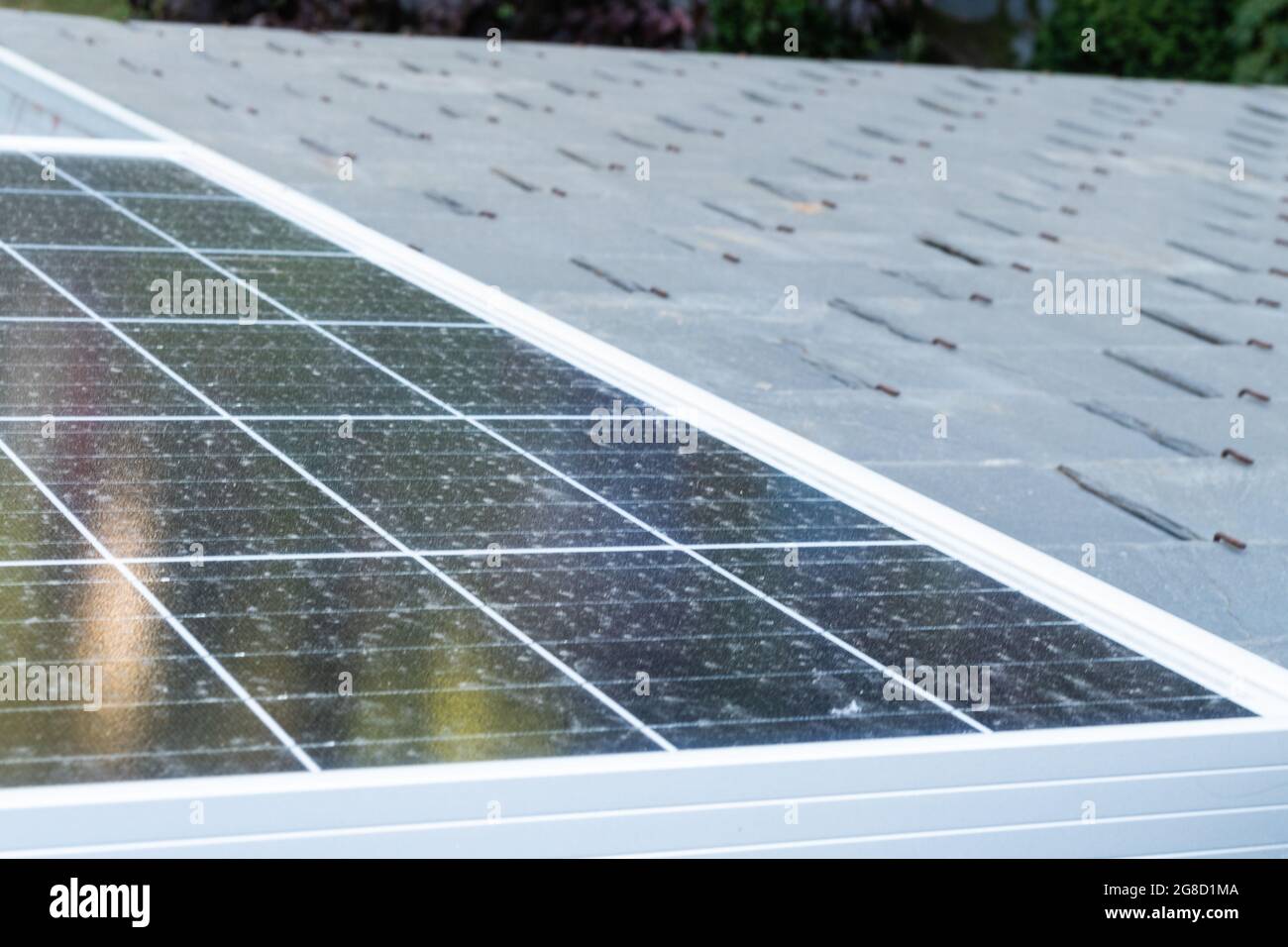 Photovoltaic cells on a roof with light reflections Stock Photo - Alamy