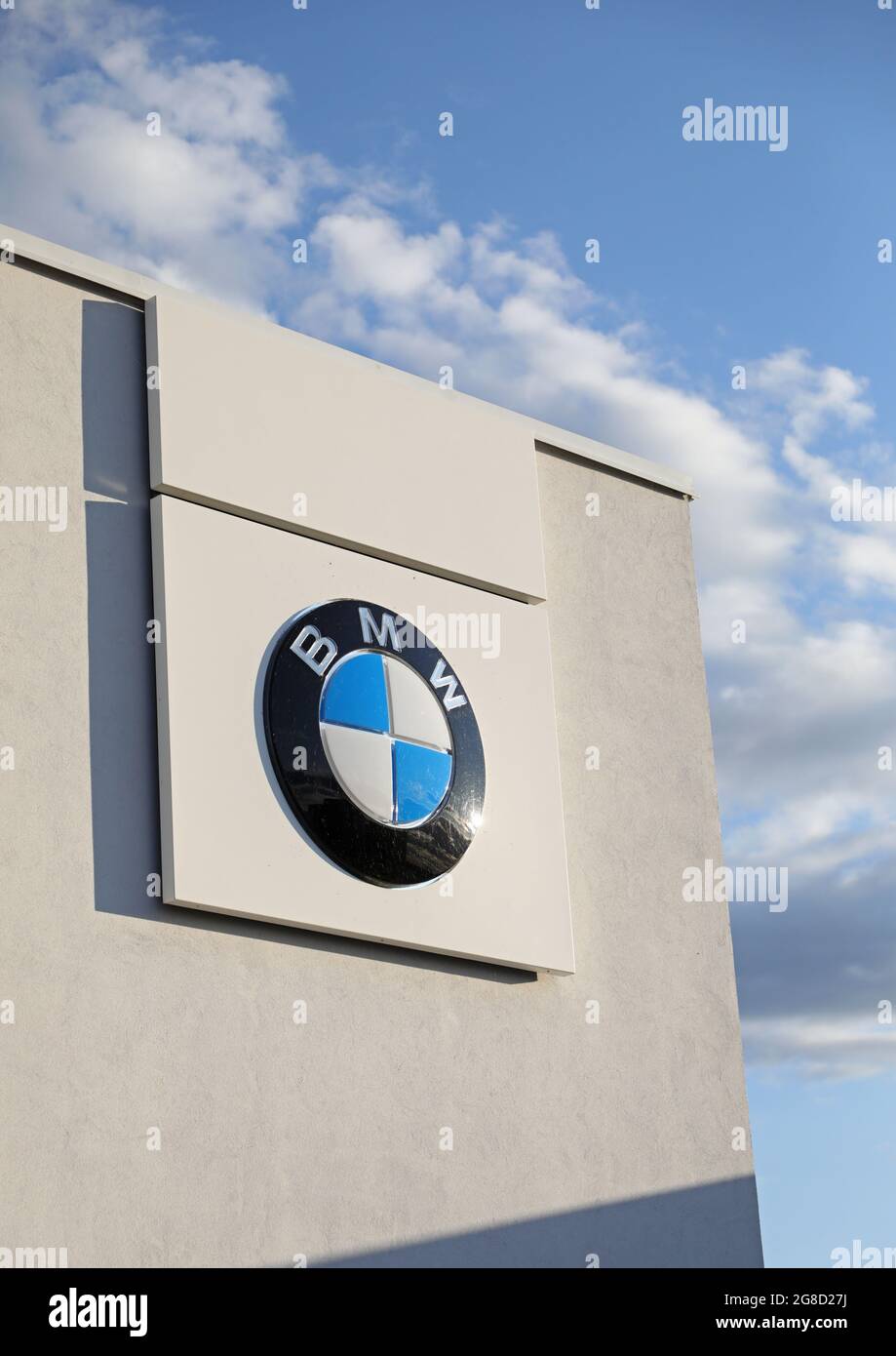 BMW logo on the facade at a BMW car dealership Stock Photo - Alamy