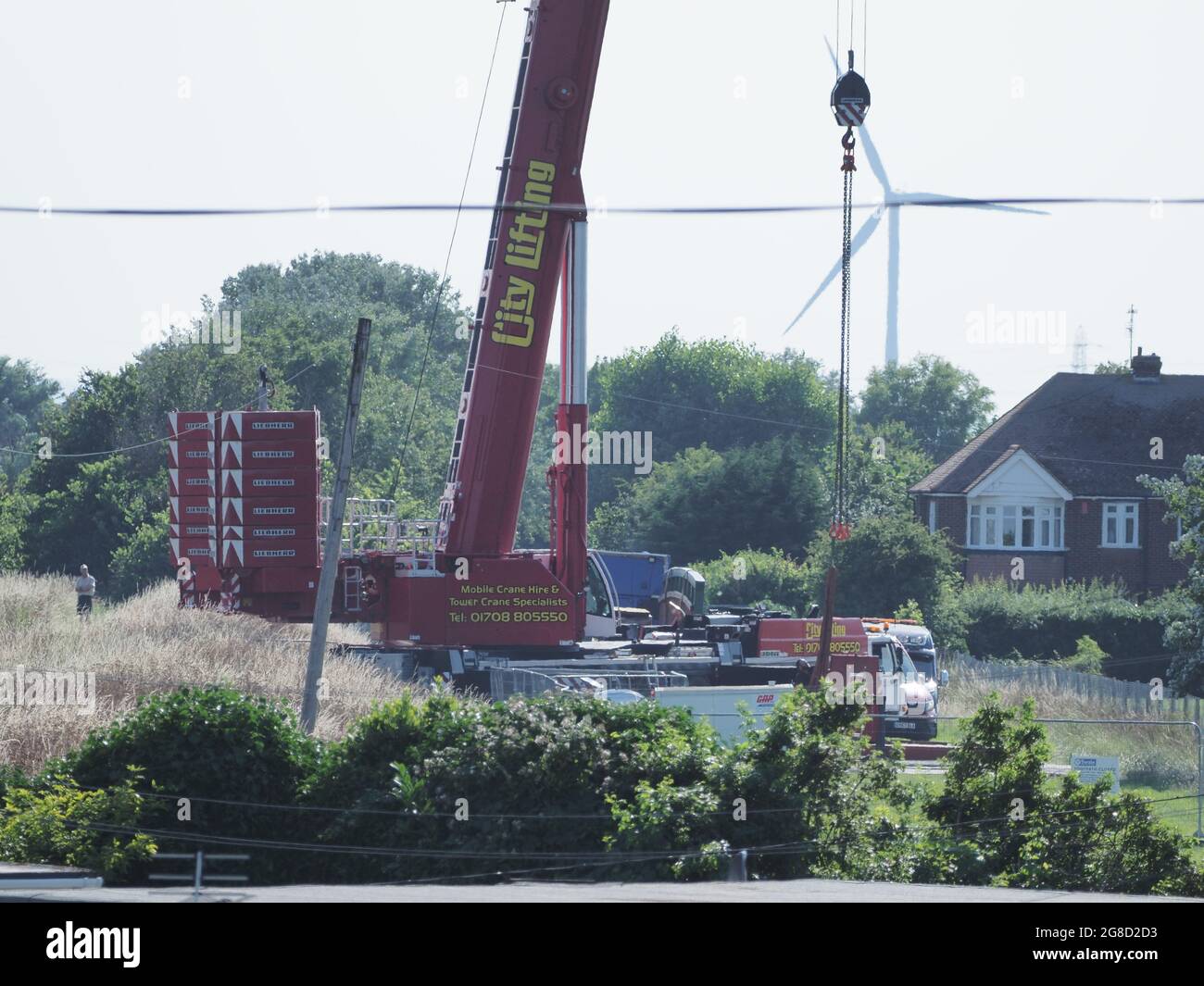 Sheerness, Kent, UK. 19th July 2021. Cranes make preparations to ...