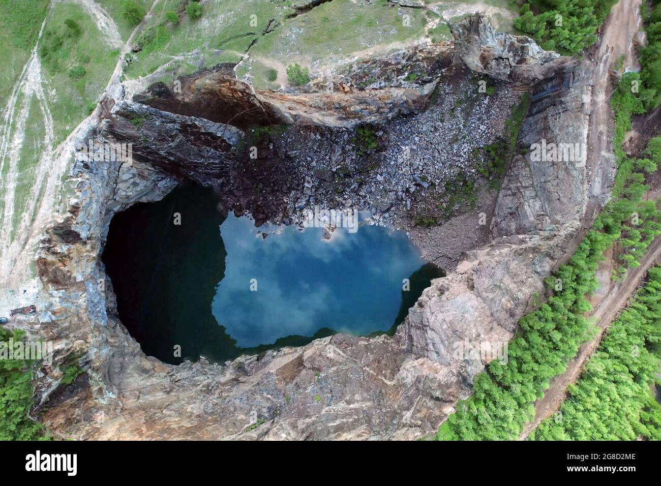Tuimsky sinkhole, collapsed mine, top view. the resulting lake in the ...