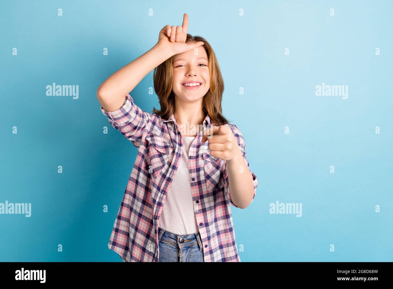 Photo of rude bully small girl wear checkered shirt pointing finger you ...