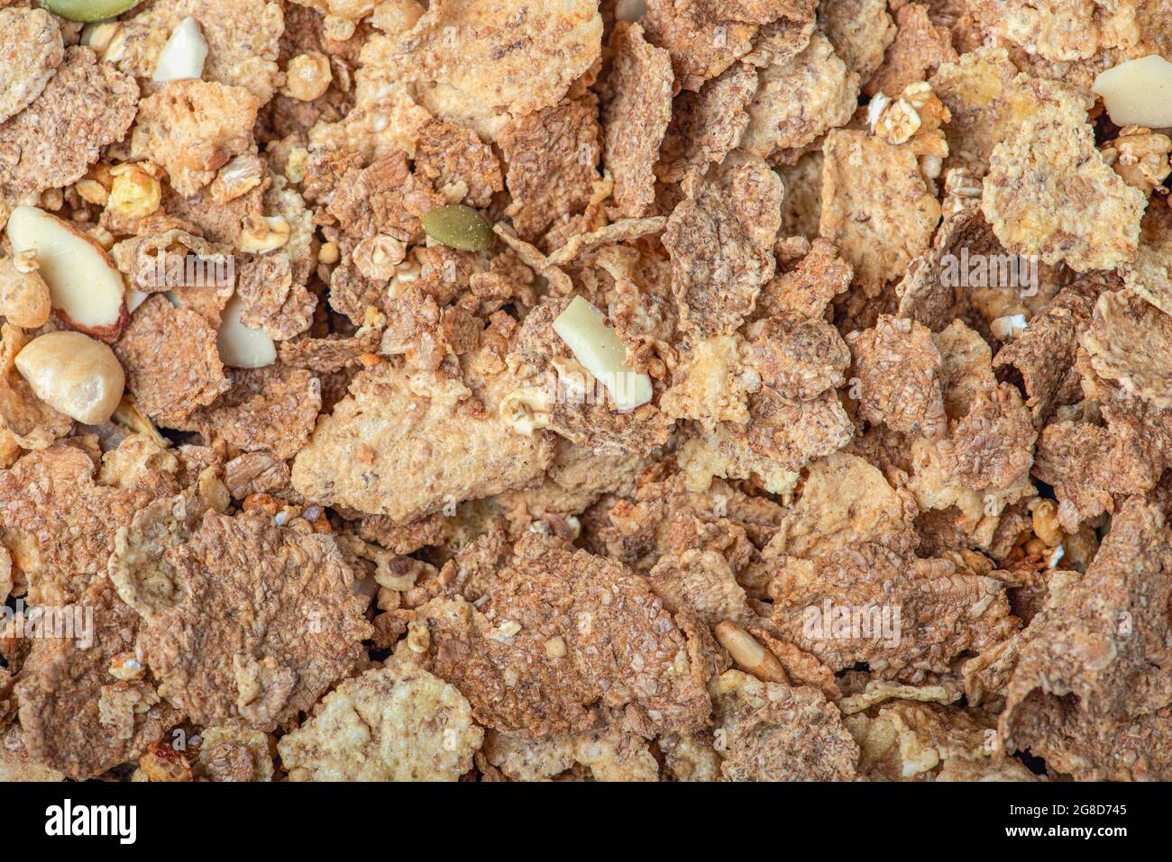 Muesli. Close-up of muesli, breakfast cereals scattered on the table ...