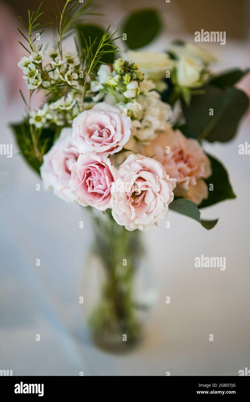 Vertical glass vase with floral decorations Stock Photo - Alamy