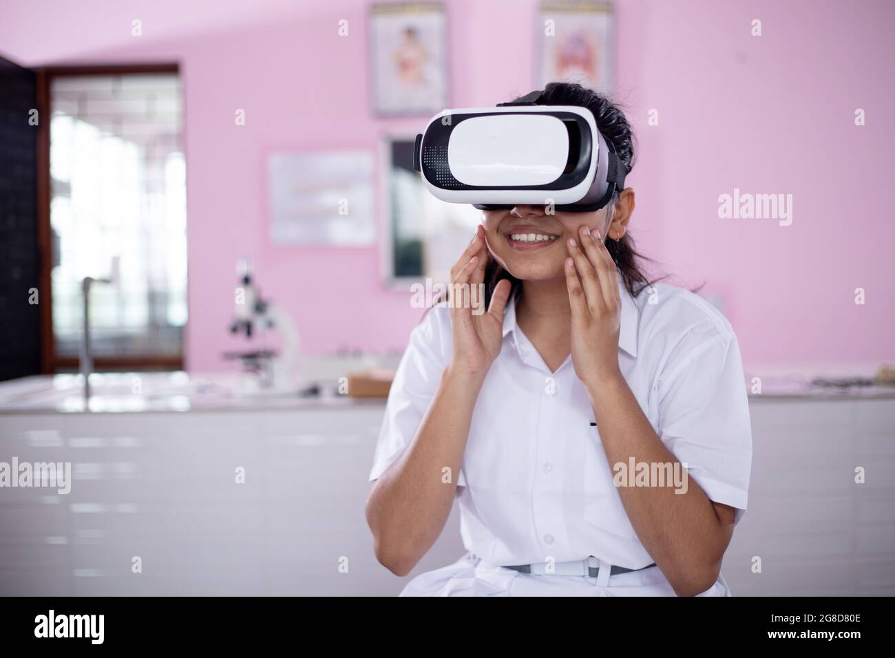 Girl wearing VR virtual reality goggles interaction headset ...