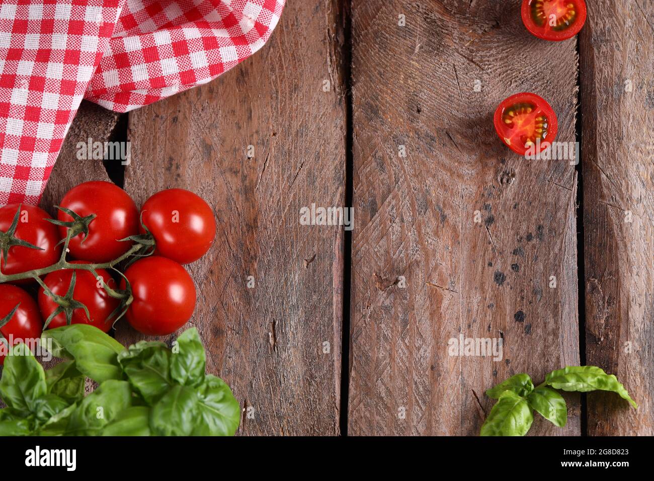 wooden food background with tomatoes and basil Stock Photo - Alamy