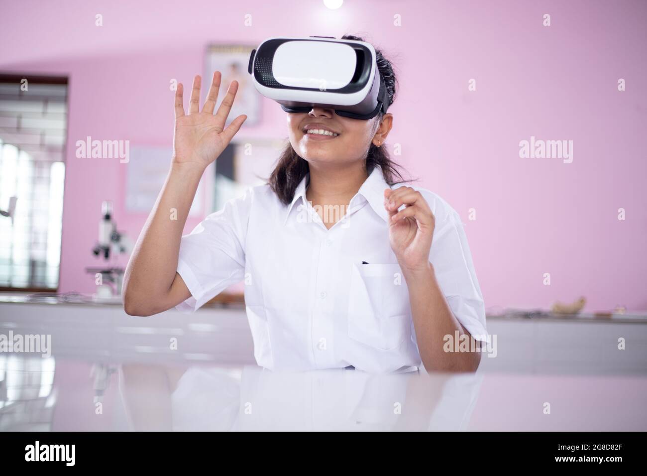 Girl wearing VR virtual reality goggles interaction headset ...