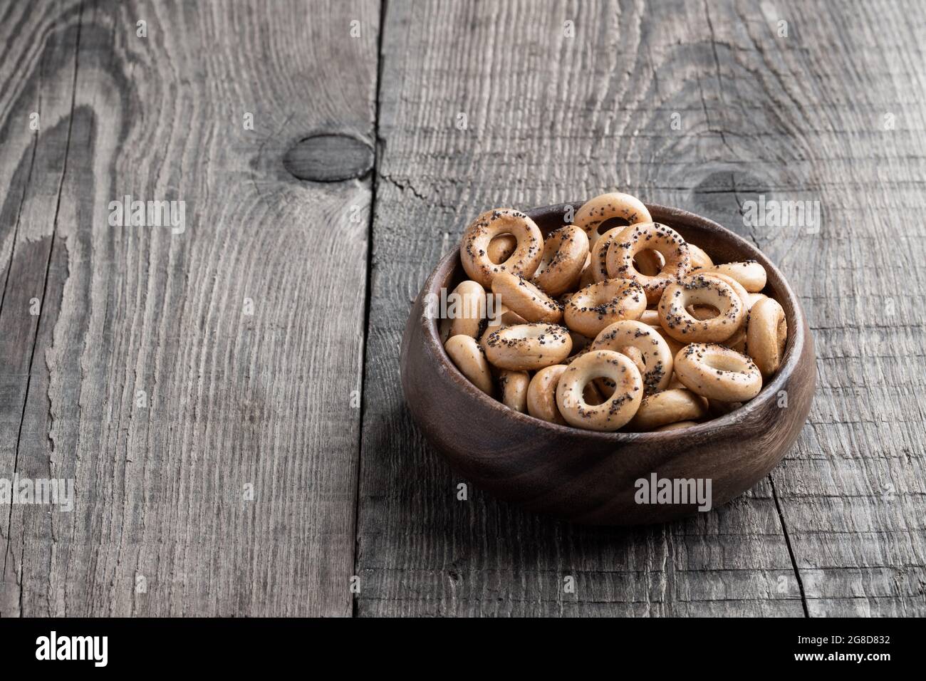 Bowl full of small traditional russian bread rings on wooden table ...