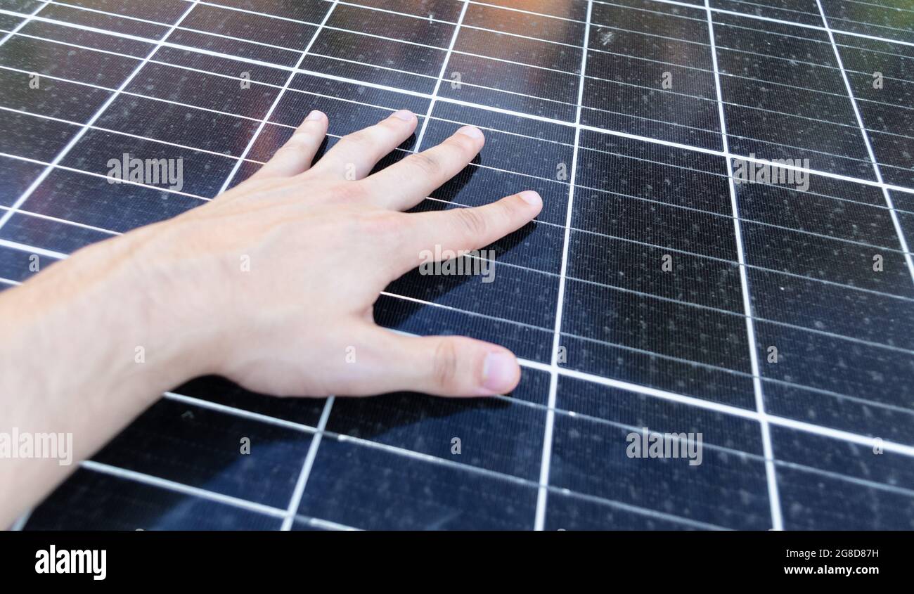 Solar energy human hand on top of solar panel renewable energy Stock ...