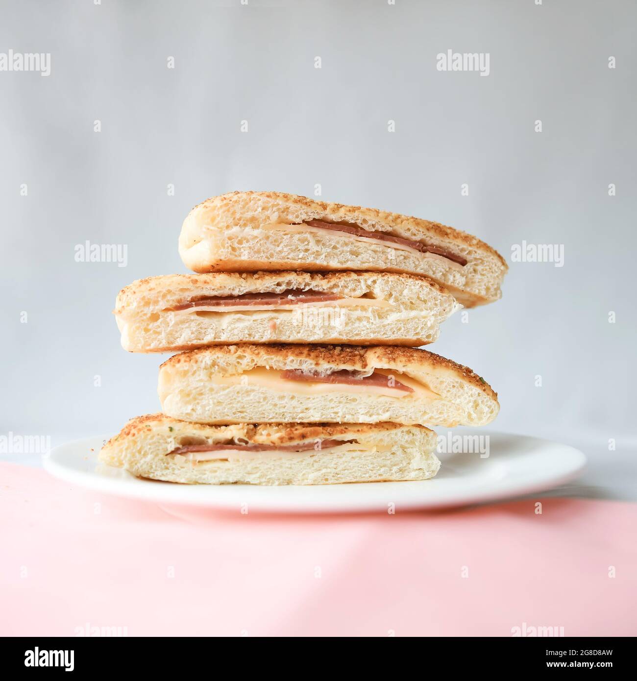 pile of ham bread on light colored background Stock Photo - Alamy