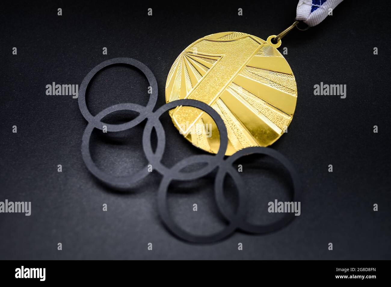 TOKYO, JAPAN, JULY. 19. 2021: Gold medal and olympic logo. Winner of ...