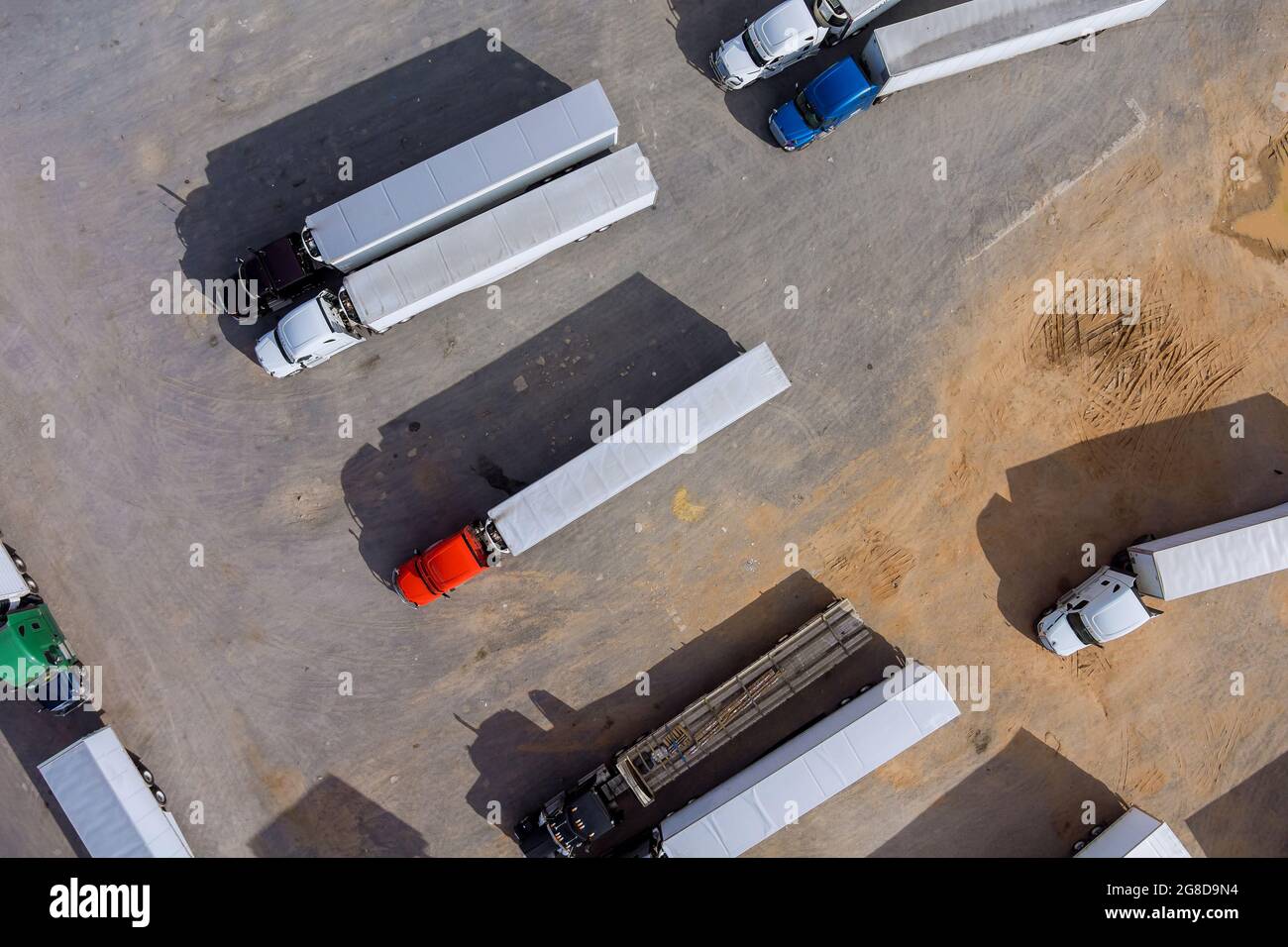 Resting place with various types of trucks in a crowded parking lot off ...